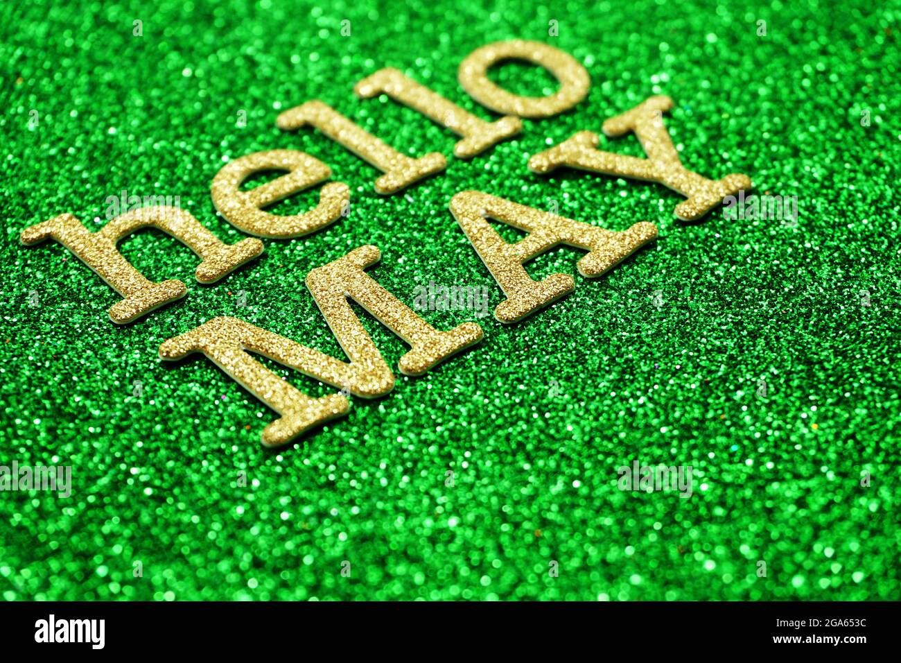 Hello May alphabet letters on green glitter background Stock Photo - Alamy