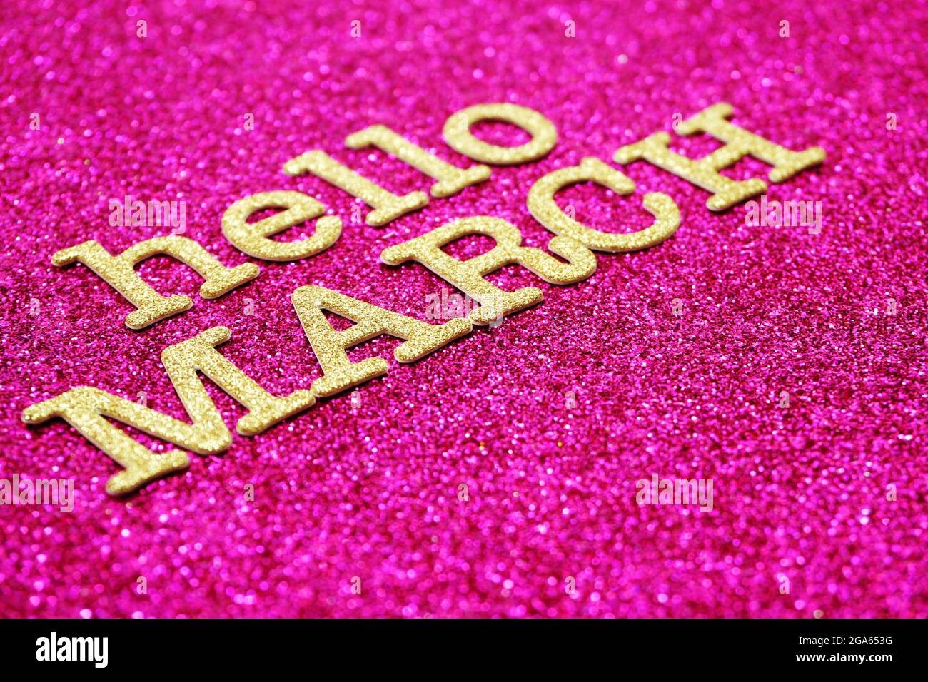 Hello March alphabet letters on pink glitter background Stock Photo - Alamy