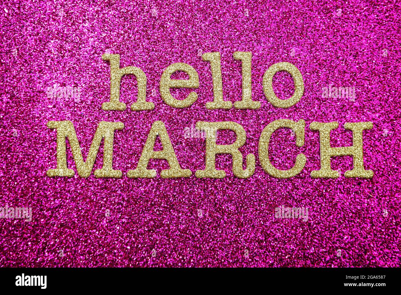Hello March alphabet letters on pink glitter background Stock Photo - Alamy