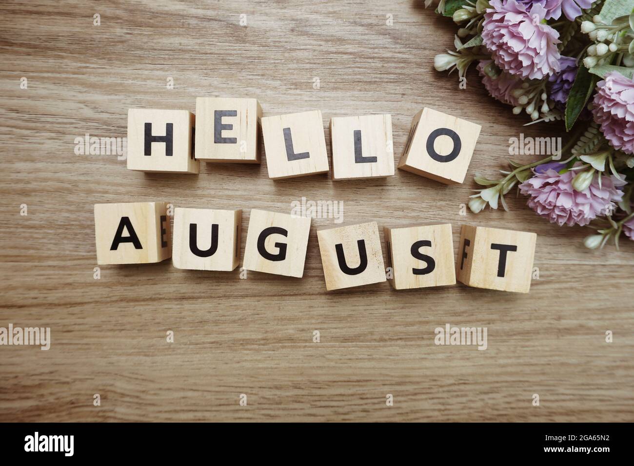 Hello August alphabet letters on wooden background Stock Photo - Alamy
