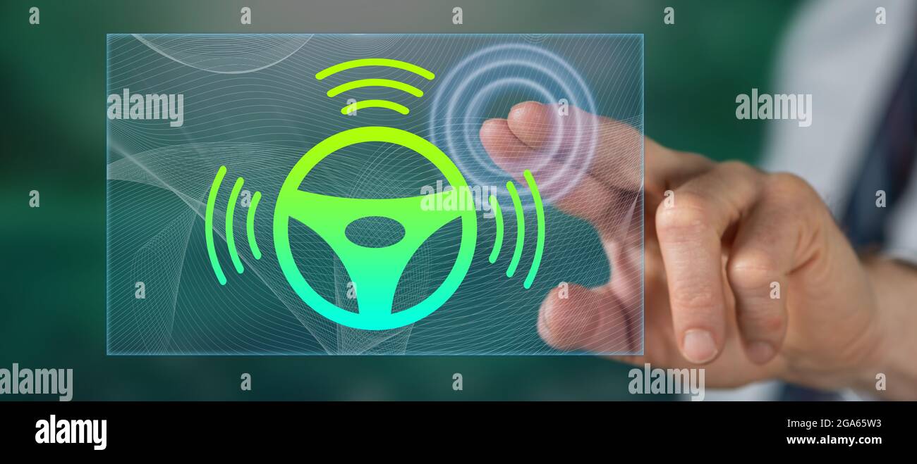 Man touching a self-driving car concept on a touch screen with his ...