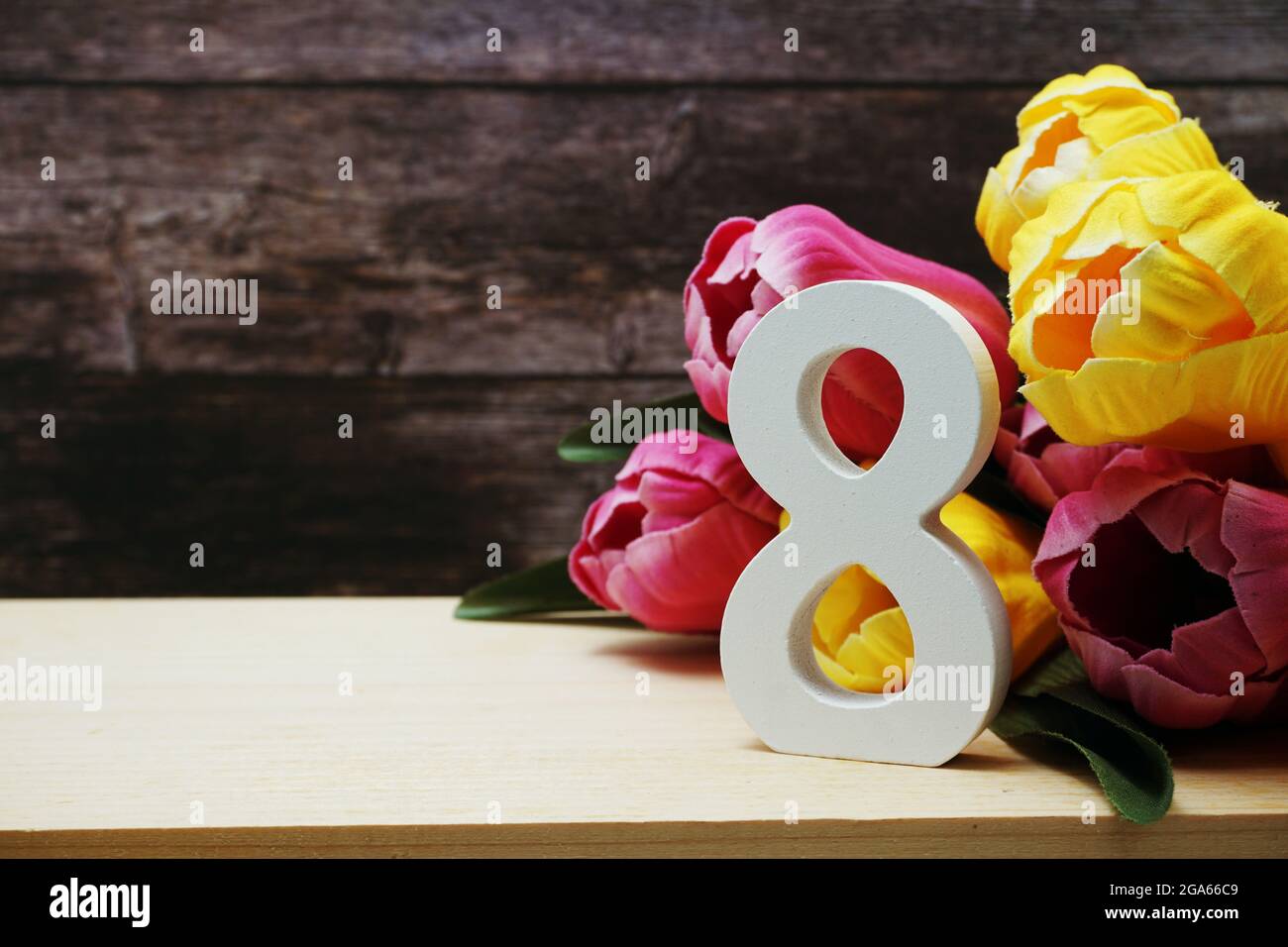 Women's day with 8 letter and tulip flowers bouquet with space copy on ...