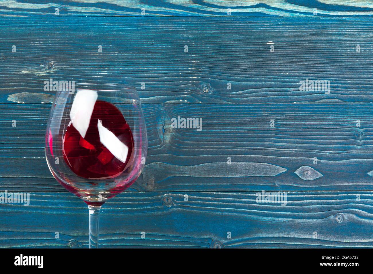 Goblet of red wine on wooden table on wooden wall background Stock ...