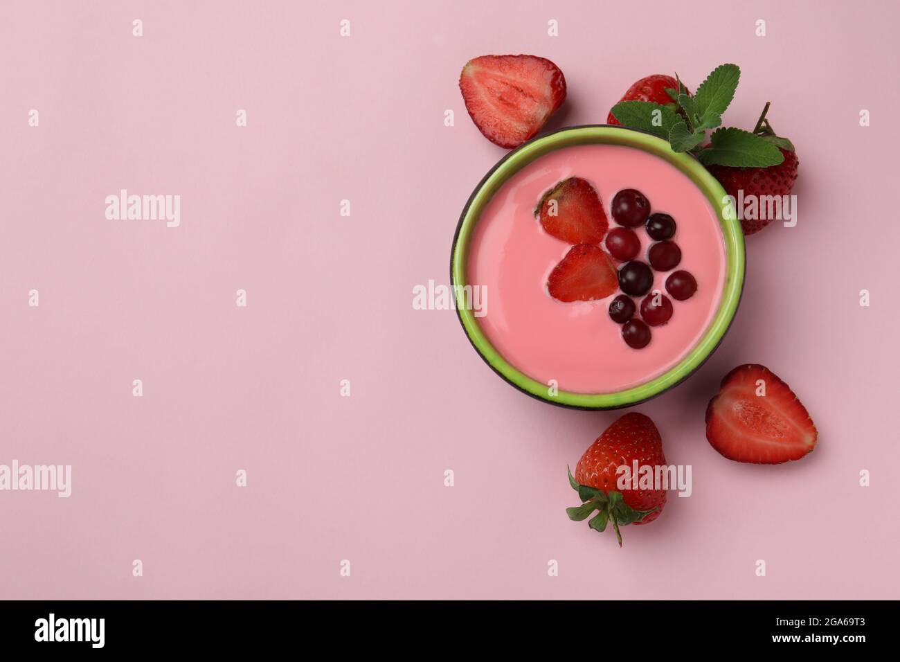 Concept of tasty breakfast with yogurt on pink background Stock Photo ...