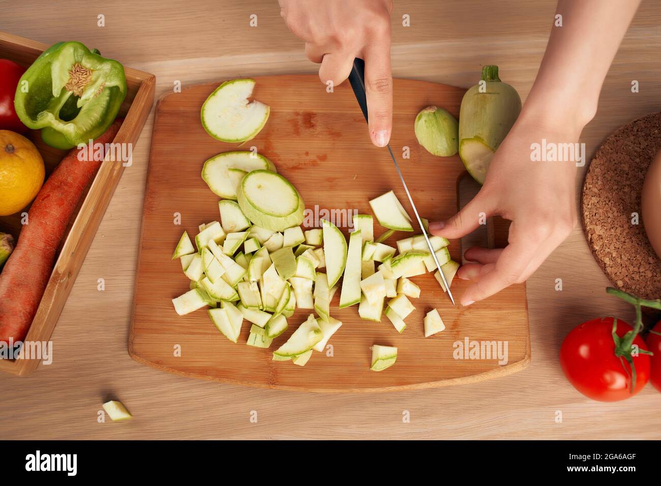 cutting vegetables healthy eating kitchen homework Stock Photo - Alamy