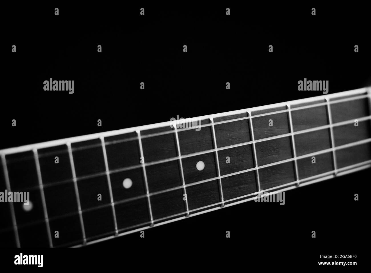 Classical guitar close up on dark background Stock Photo - Alamy