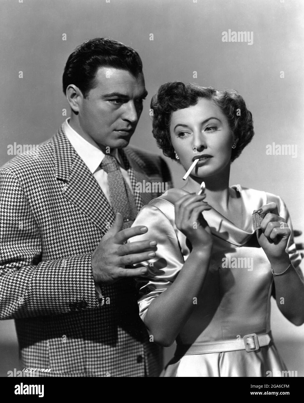 BARBARA STANWYCK and STEPHEN McNALLY posed publicity portrait in THE LADY GAMBLES 1949 director ...