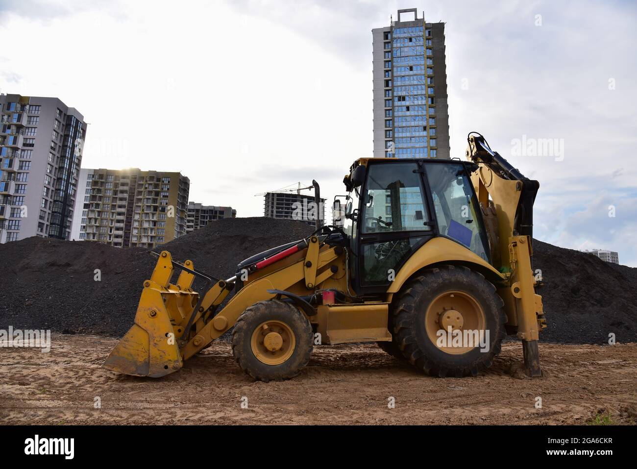 Tractor during excavation and road construction works at construction ...