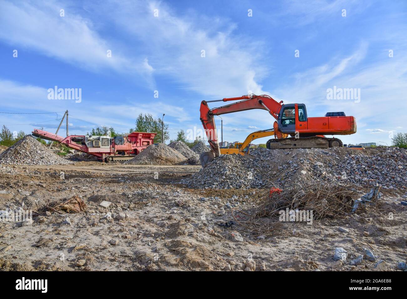 Excavator work at landfill with concrete demolition waste. Salvaging ...