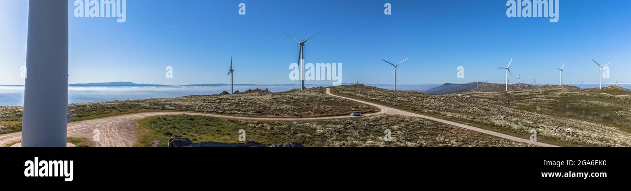 Ultra panoramic view at the Caramulo mountains, with wind turbines and ...