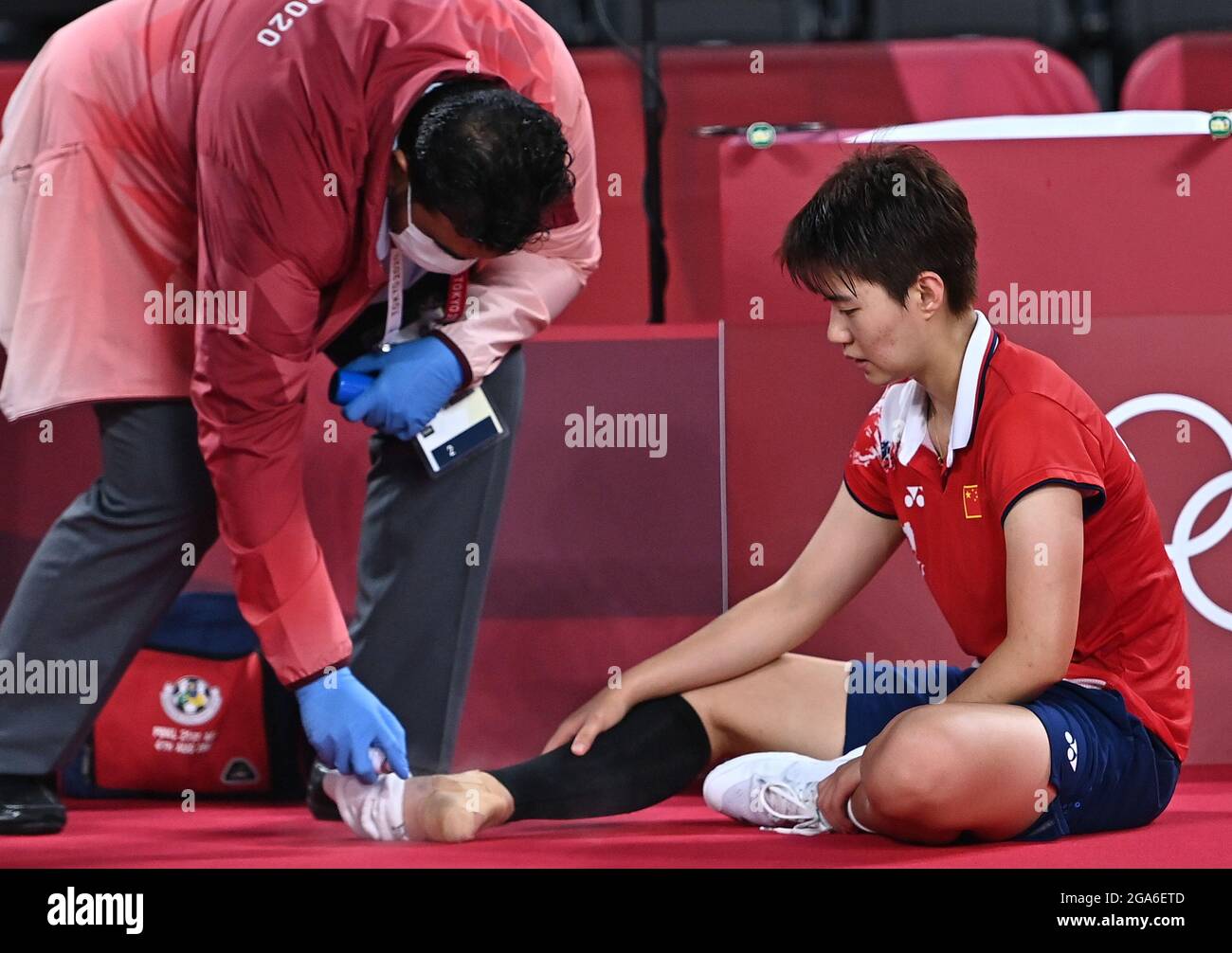 Tokyo, Japan. 29th July, 2021. China's Du Yue receives treatment during ...
