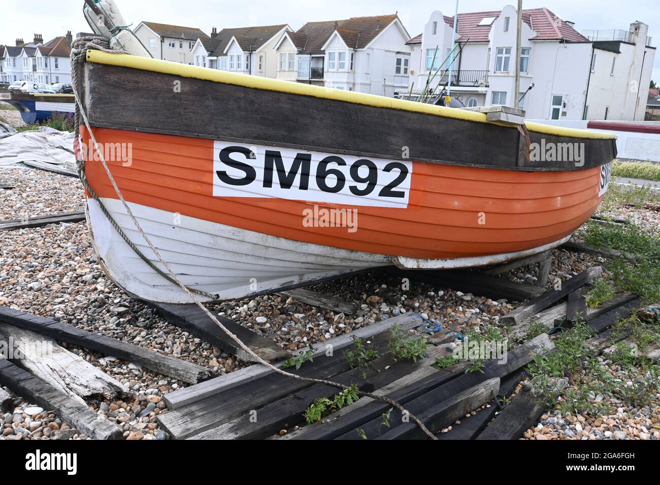 Fishing Boat ashore on Shoreham seafront, East Sussex, UK Stock Photo ...
