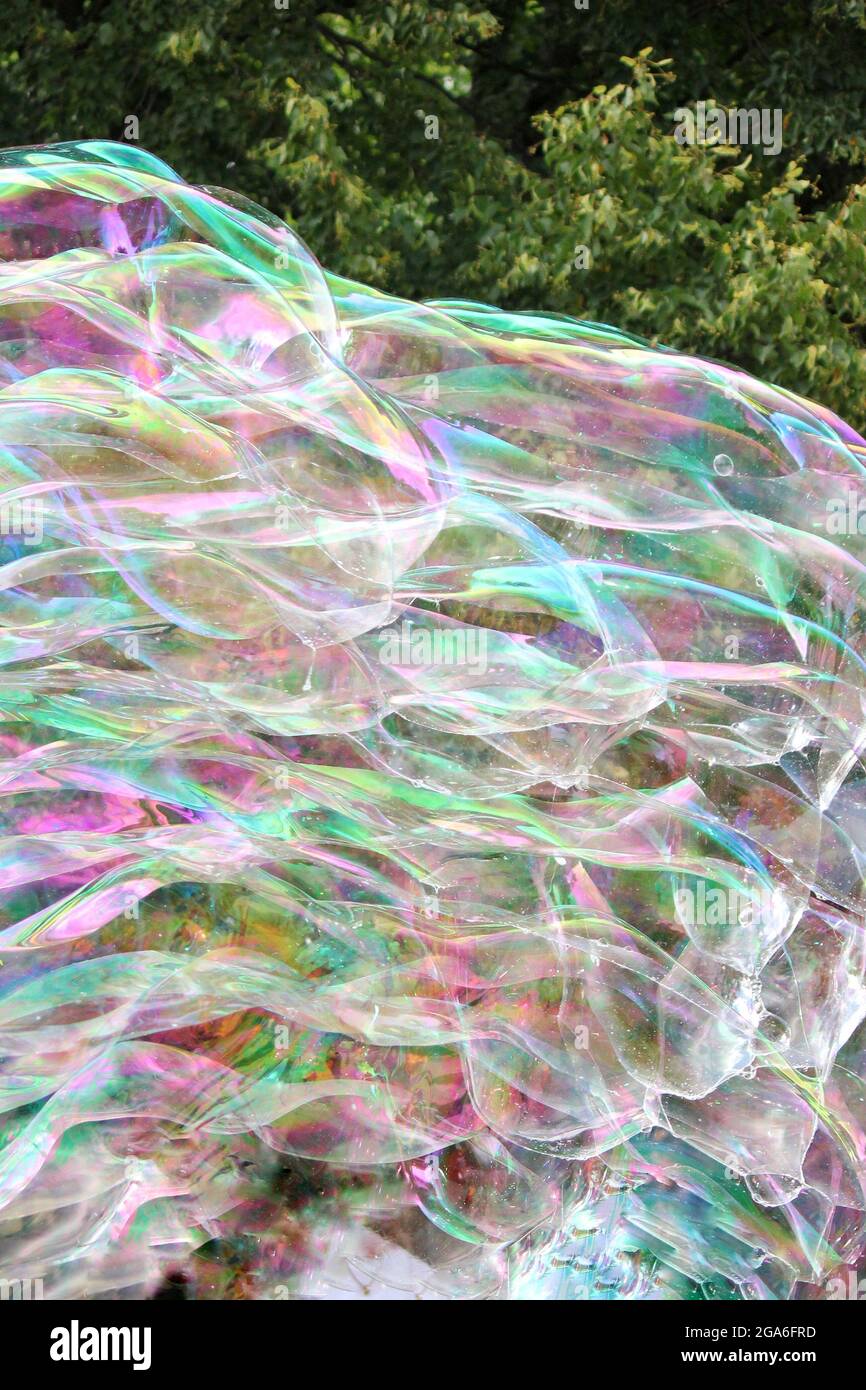 Huge bubbles floating thru the air on a beautiful summer day Stock ...