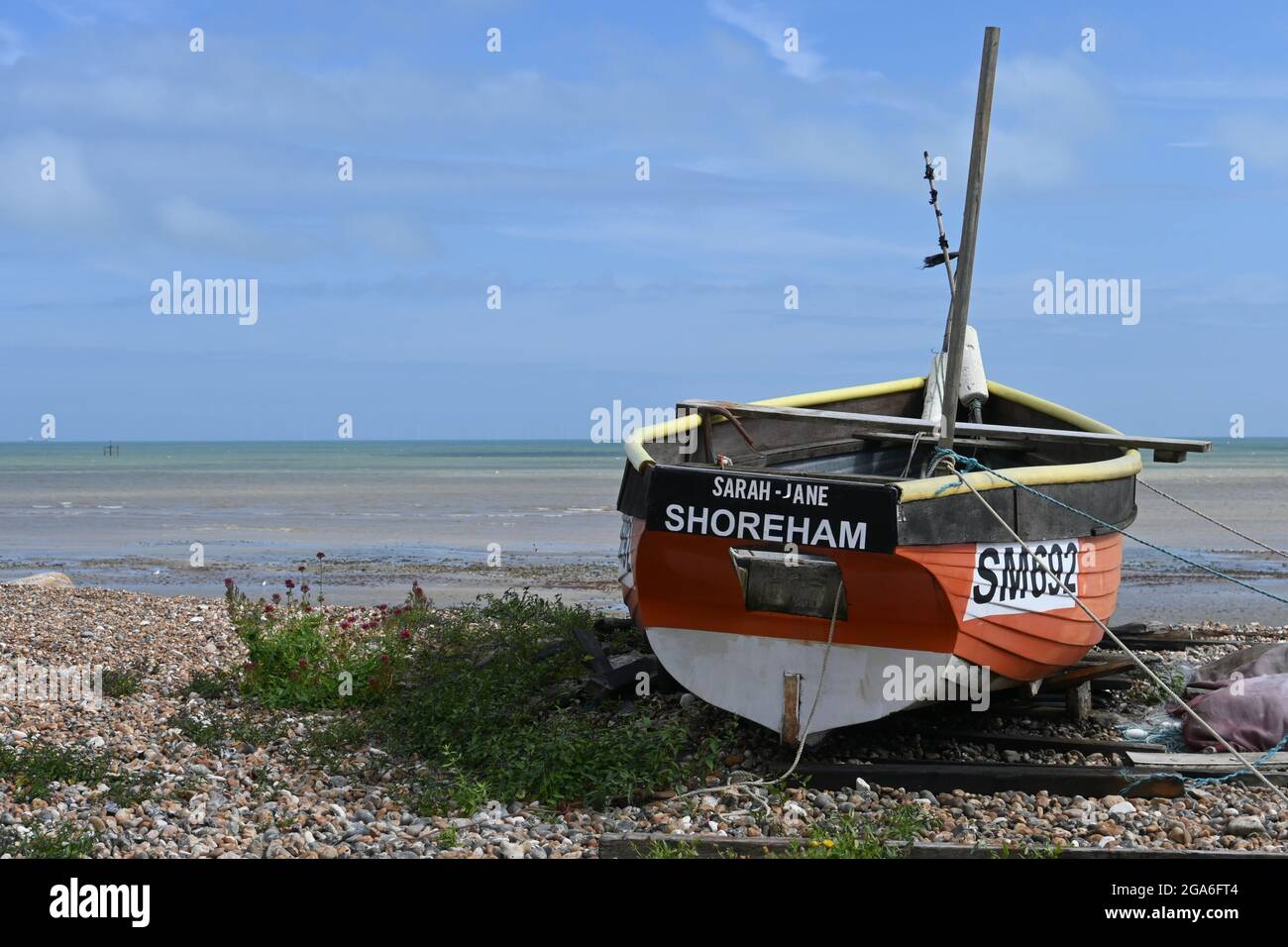 Fishing Boat ashore on Shoreham seafront, East Sussex, UK Stock Photo ...