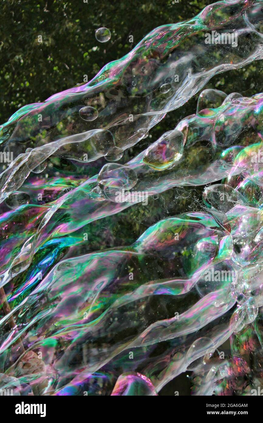 Huge bubbles floating thru the air on a beautiful summer day Stock ...