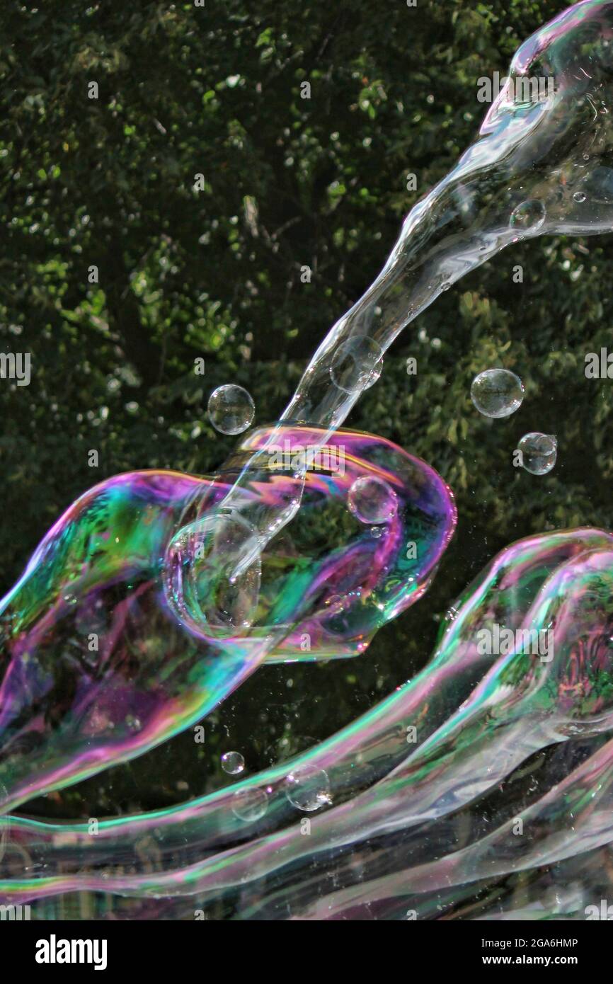 Huge bubbles floating thru the air on a beautiful summer day Stock ...