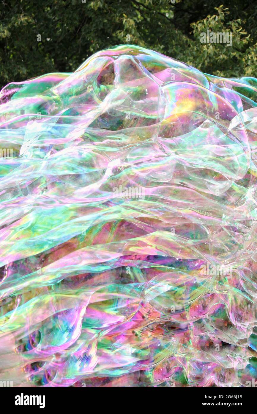 Huge bubbles floating thru the air on a beautiful summer day Stock ...