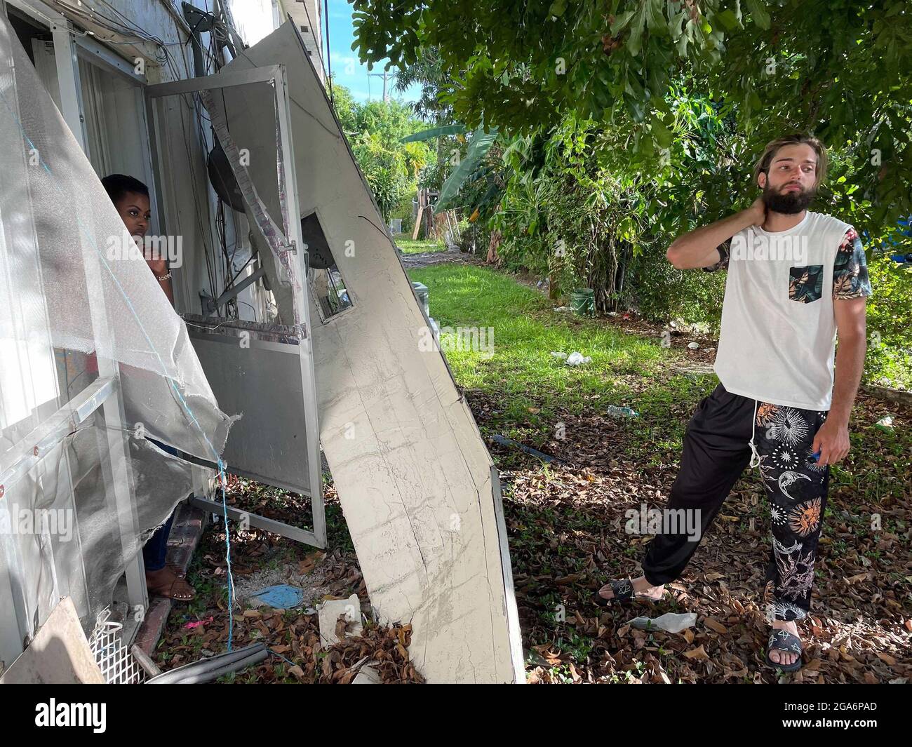 USA. 22nd July, 2021. Phillex Anderson and Jacob Henning look at a ...