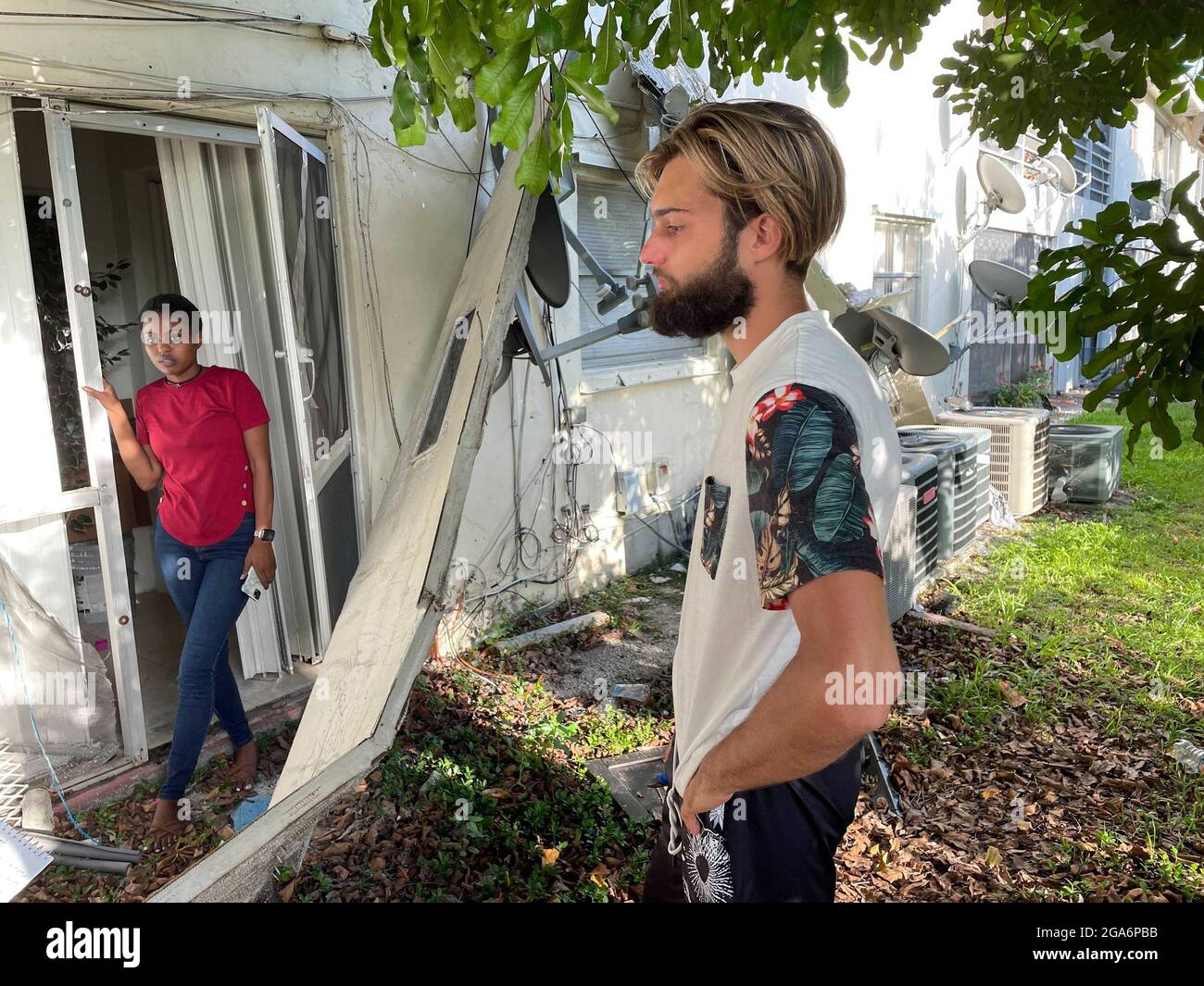 USA. 22nd July, 2021. Phillex Anderson and Jacob Henning look at a ...