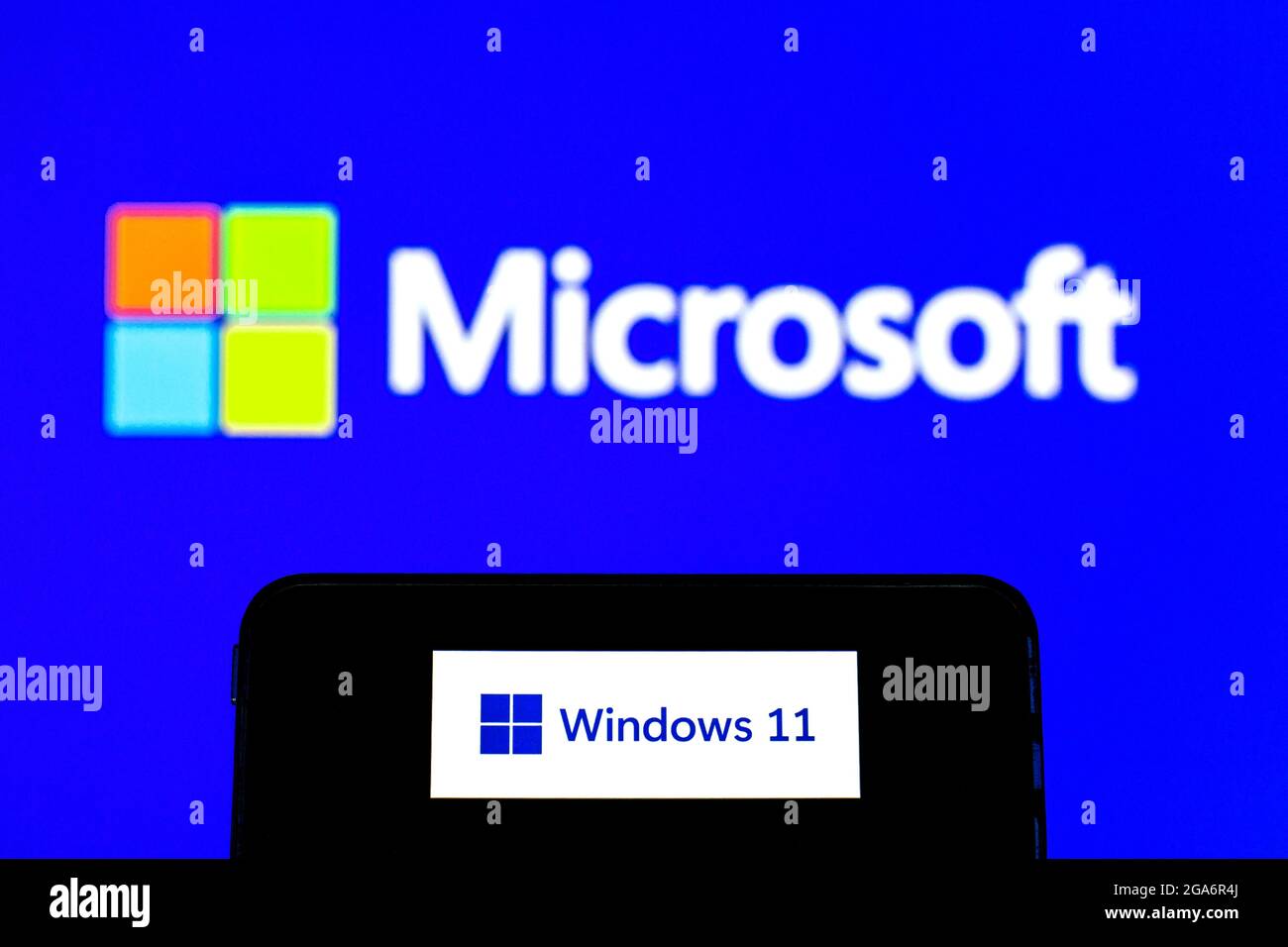 In this photo illustration a Windows 11 logo seen displayed on a ...