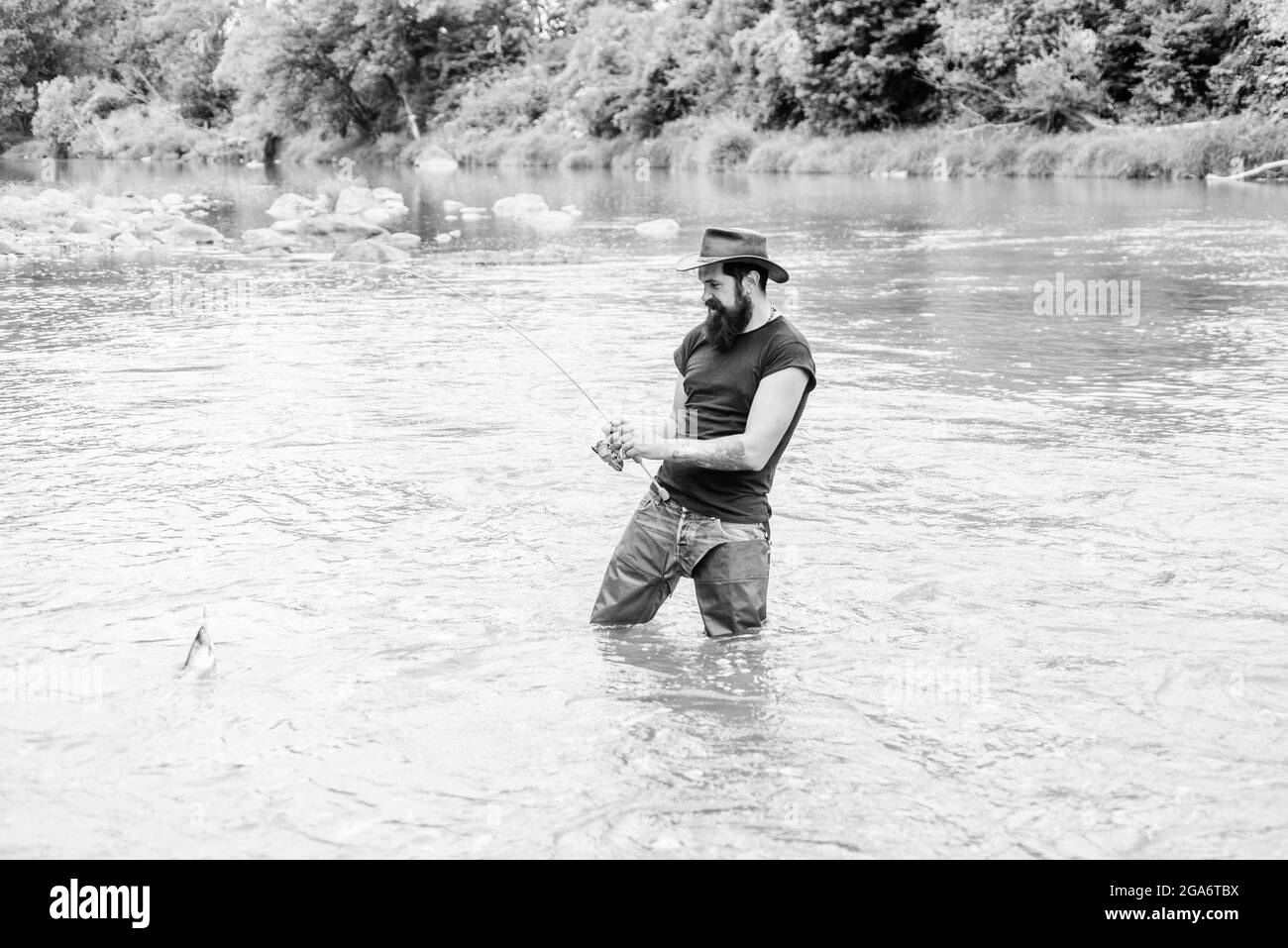 Fun of fishing is catching. Fisher with fishing equipment. Fisher ...