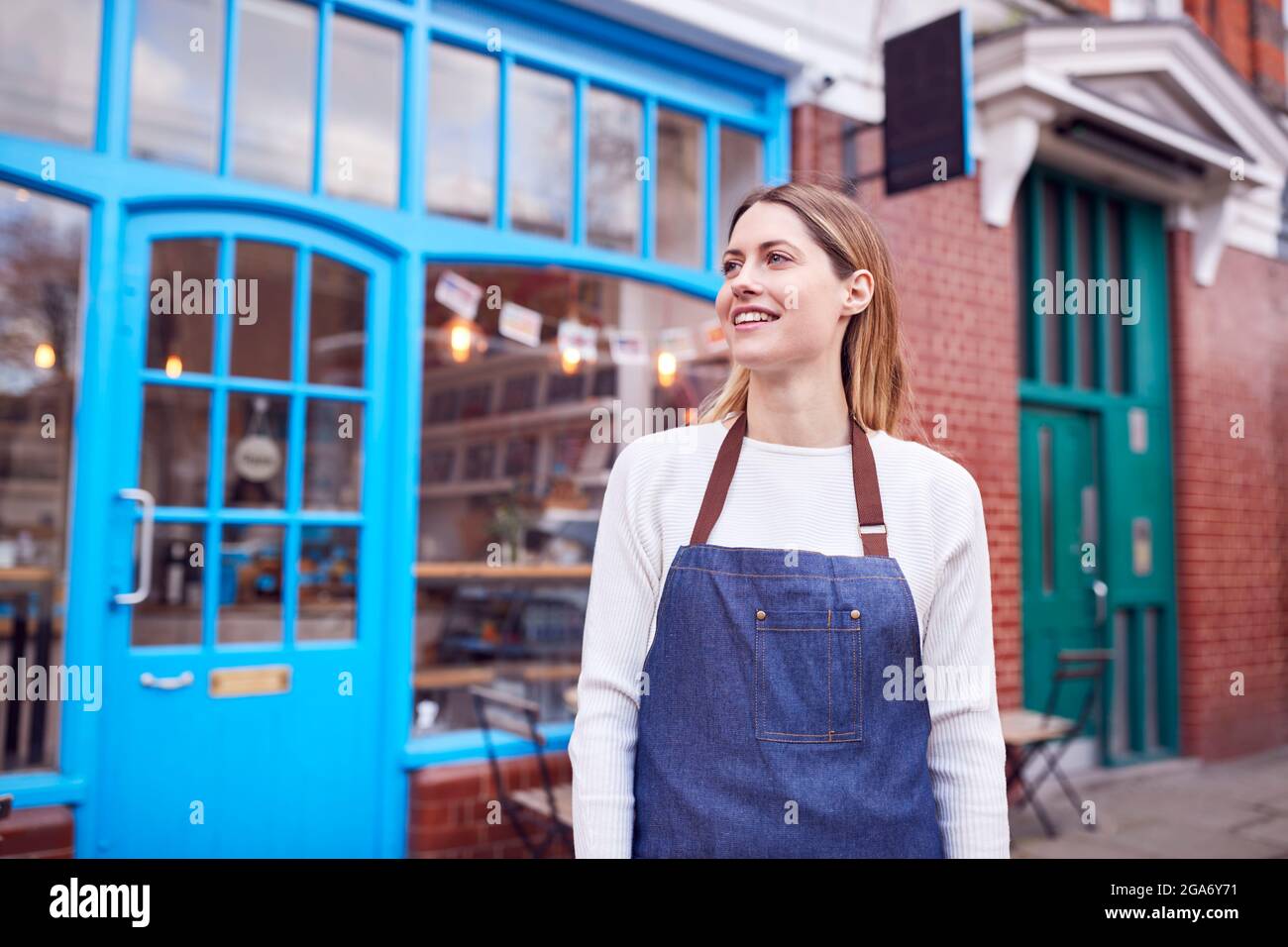 Portrait Of Smiling Female Small Business Owner Standing Outside Shop ...