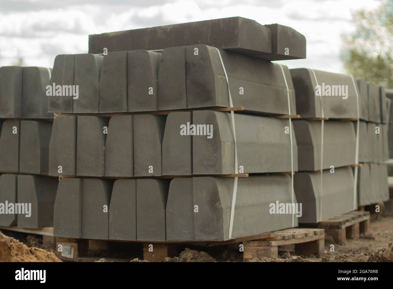 A lot of curbs on the construction site. Stone blocks for the road ...