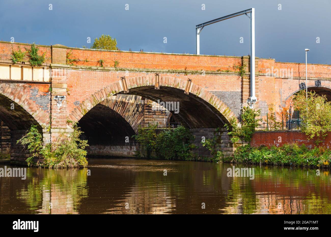 Castlefield Viaduct railway bridge crossing over the River Irwell ...