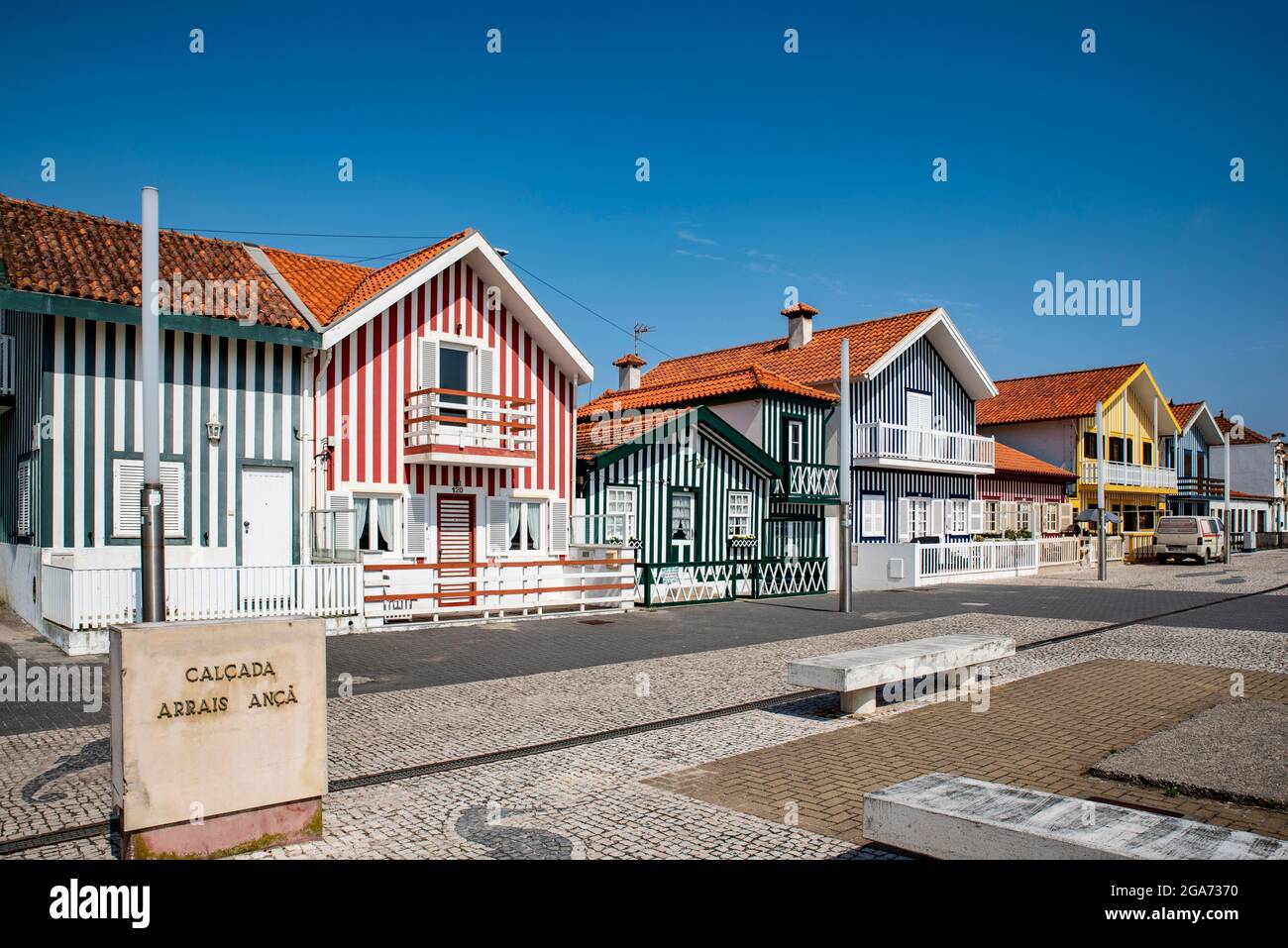 Costa Nova, Portugal: colorful striped houses called Palheiros with red ...