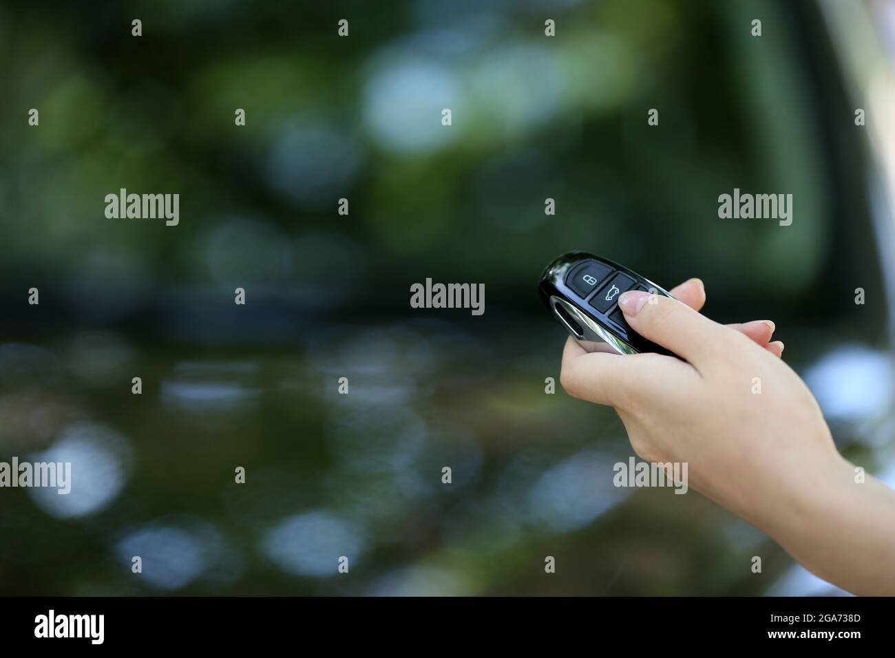 Hand presses on remote control car alarm systems Stock Photo - Alamy