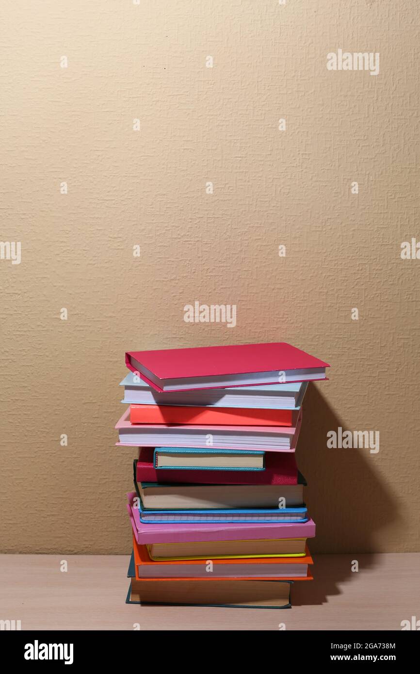 Stack of books on shelf Stock Photo - Alamy