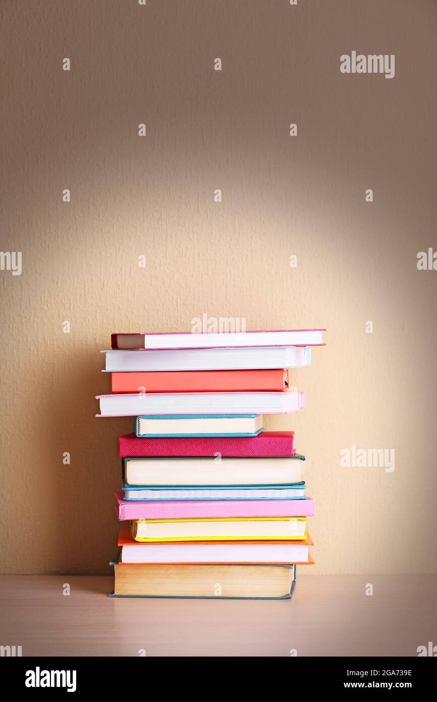 Stack of books on shelf Stock Photo - Alamy