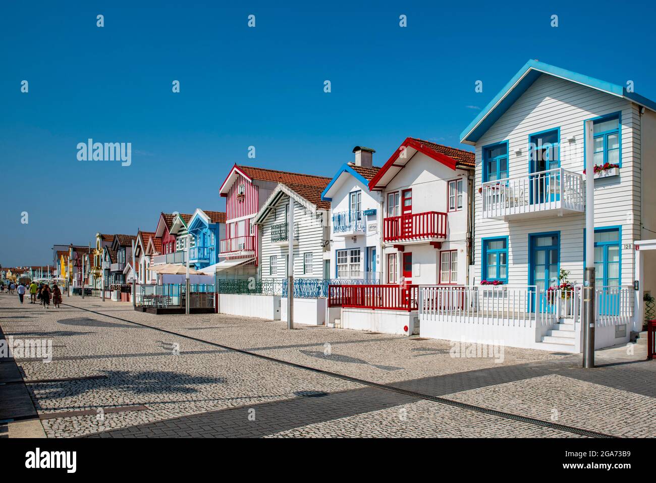 Costa Nova, Portugal: colorful striped houses called Palheiros with red ...