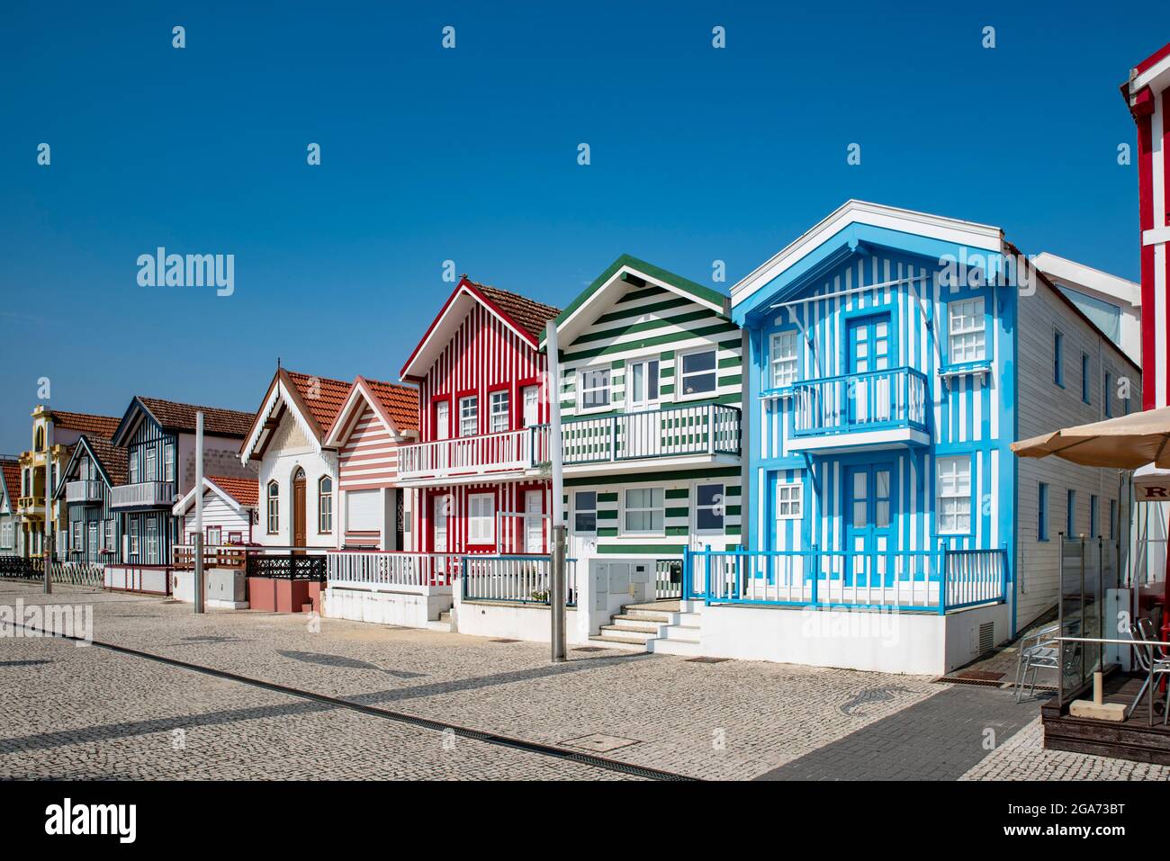 Costa Nova, Portugal: colorful striped houses called Palheiros with red ...