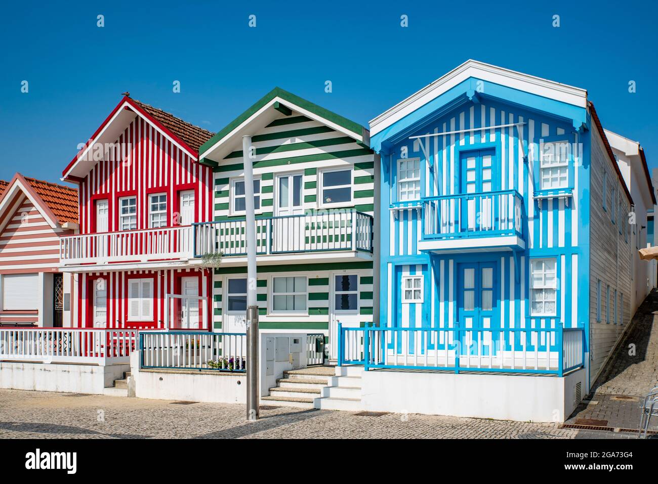 Costa Nova, Portugal: colorful striped houses called Palheiros with red ...