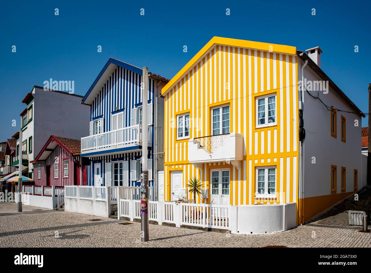 Costa Nova, Portugal: colorful striped houses called Palheiros with red ...