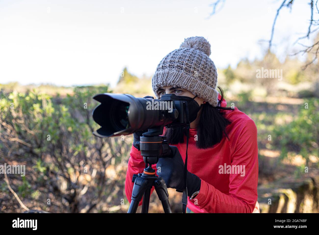 Photographer preparing to capture a scene Stock Photo - Alamy