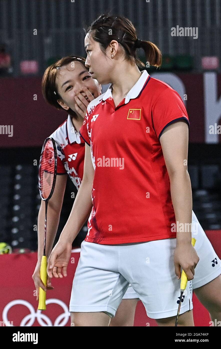 Tokyo, Japan. 29th July, 2021. China's Chen Qingchen (back) whispers to Jia Yifan during the ...