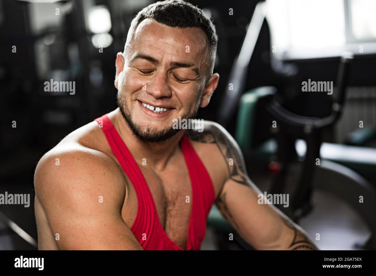 Portrait of man bodybuilder in red shirt in gym Stock Photo - Alamy