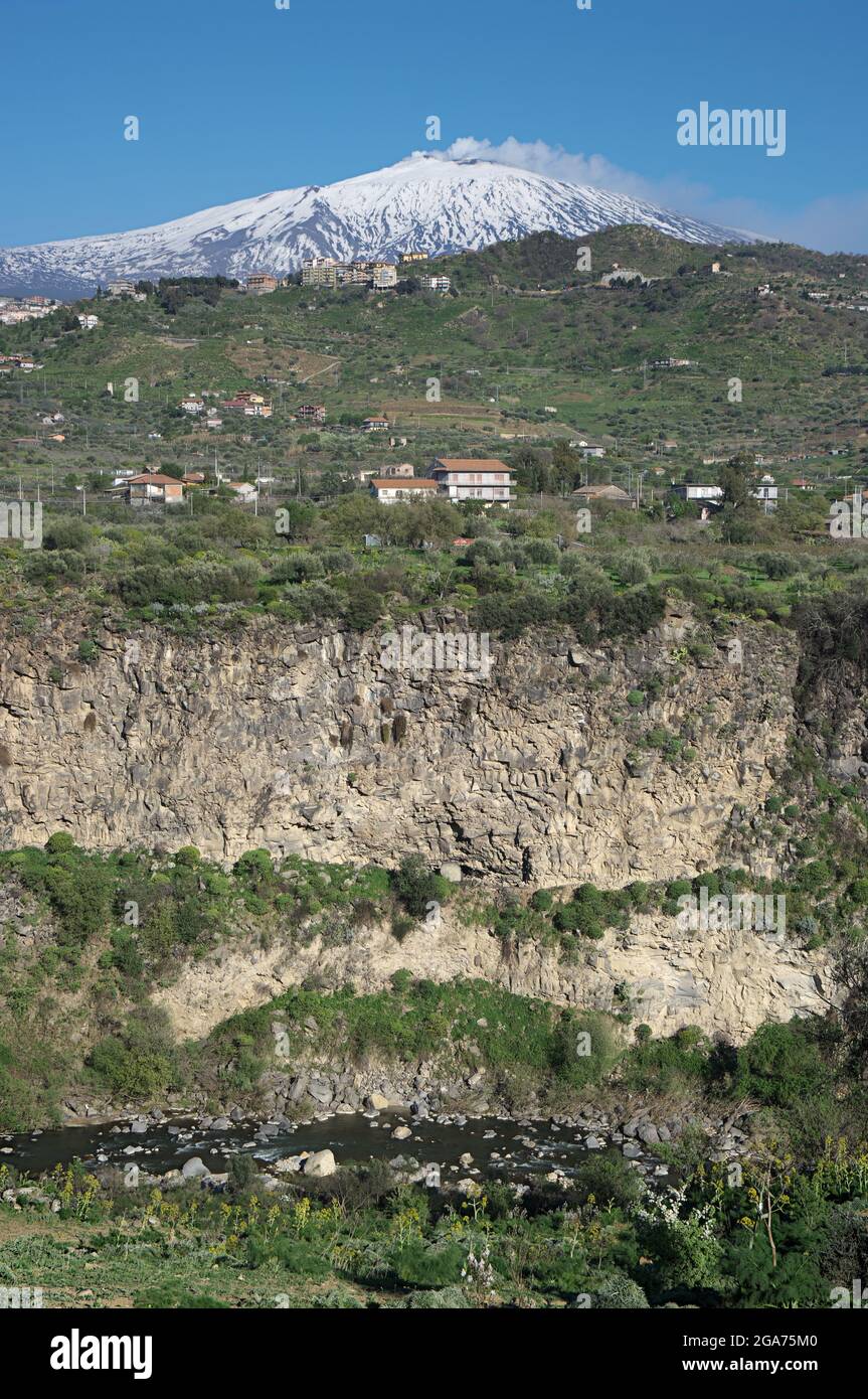 landscape of Sicily lava gorges of Simeto river and Etna Mountain snow ...