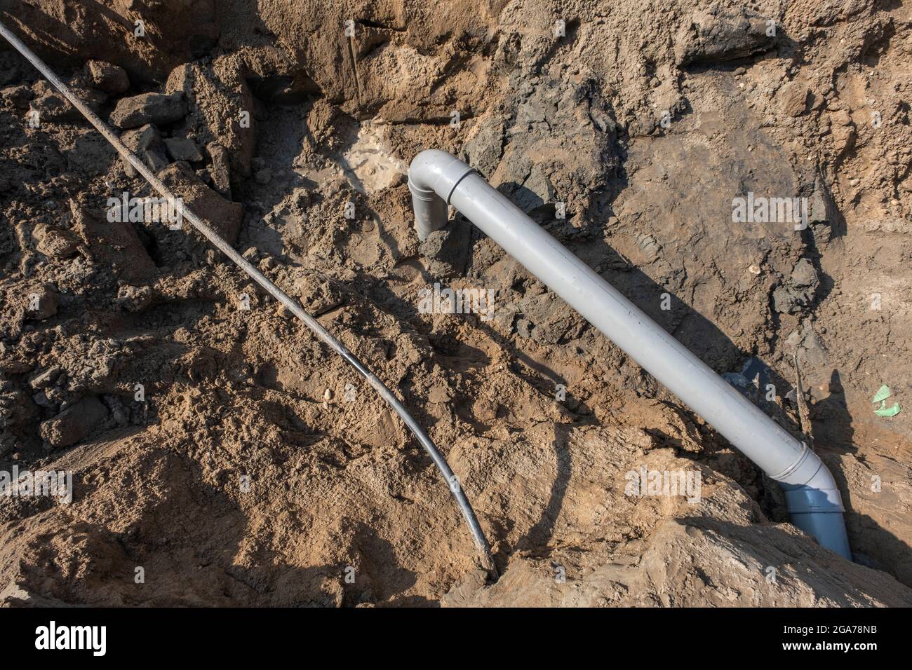 Plastic pipes in the ground during the construction of a building ...