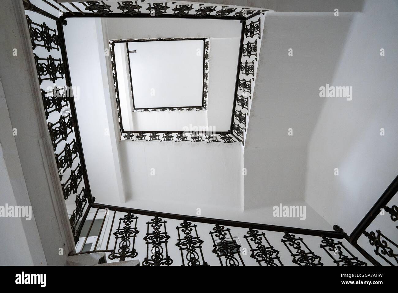 VIew of a black and white staircase, perspective on stairs from below ...