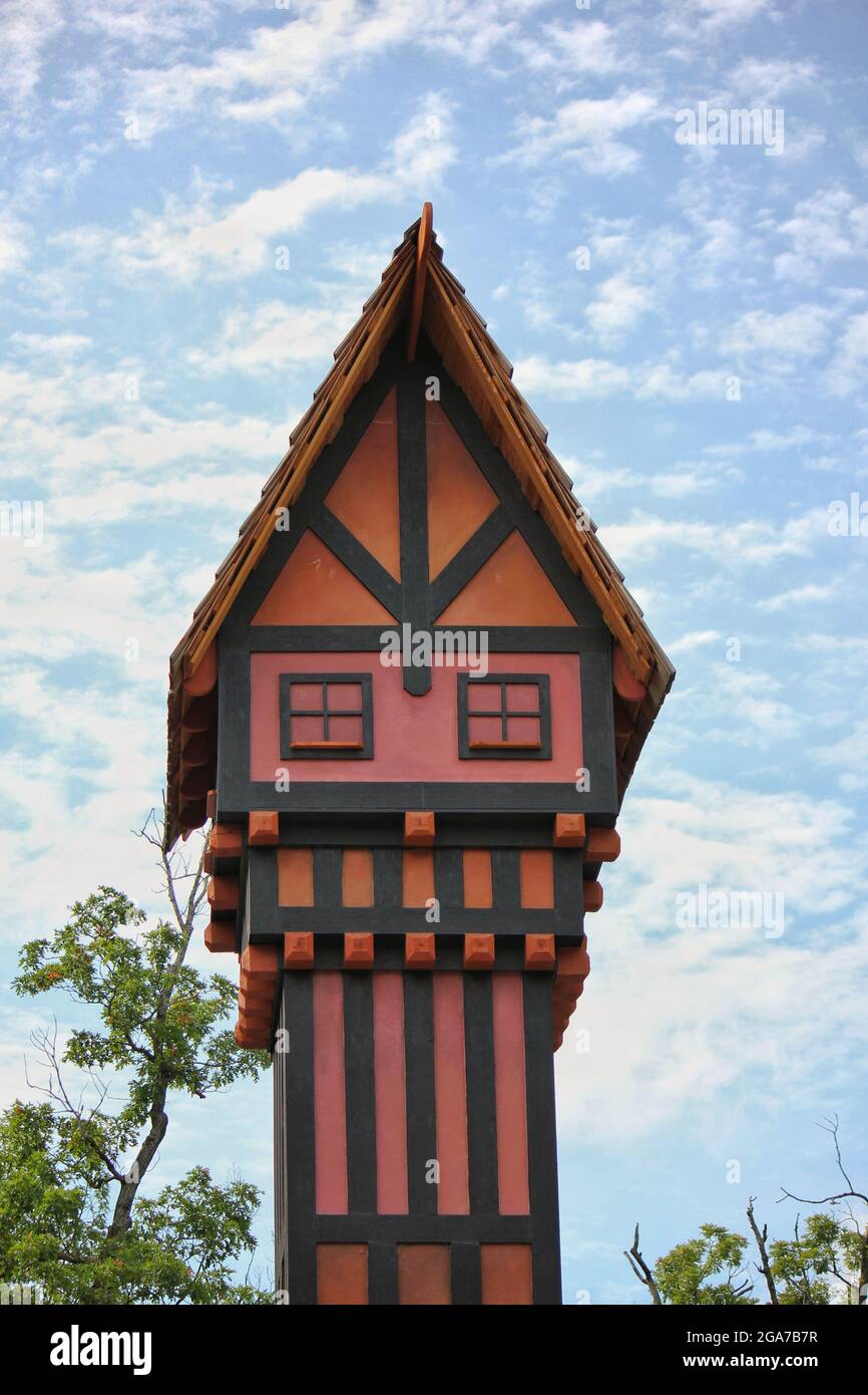 A cottage like tower standing in the fields on a beautiful summer day ...