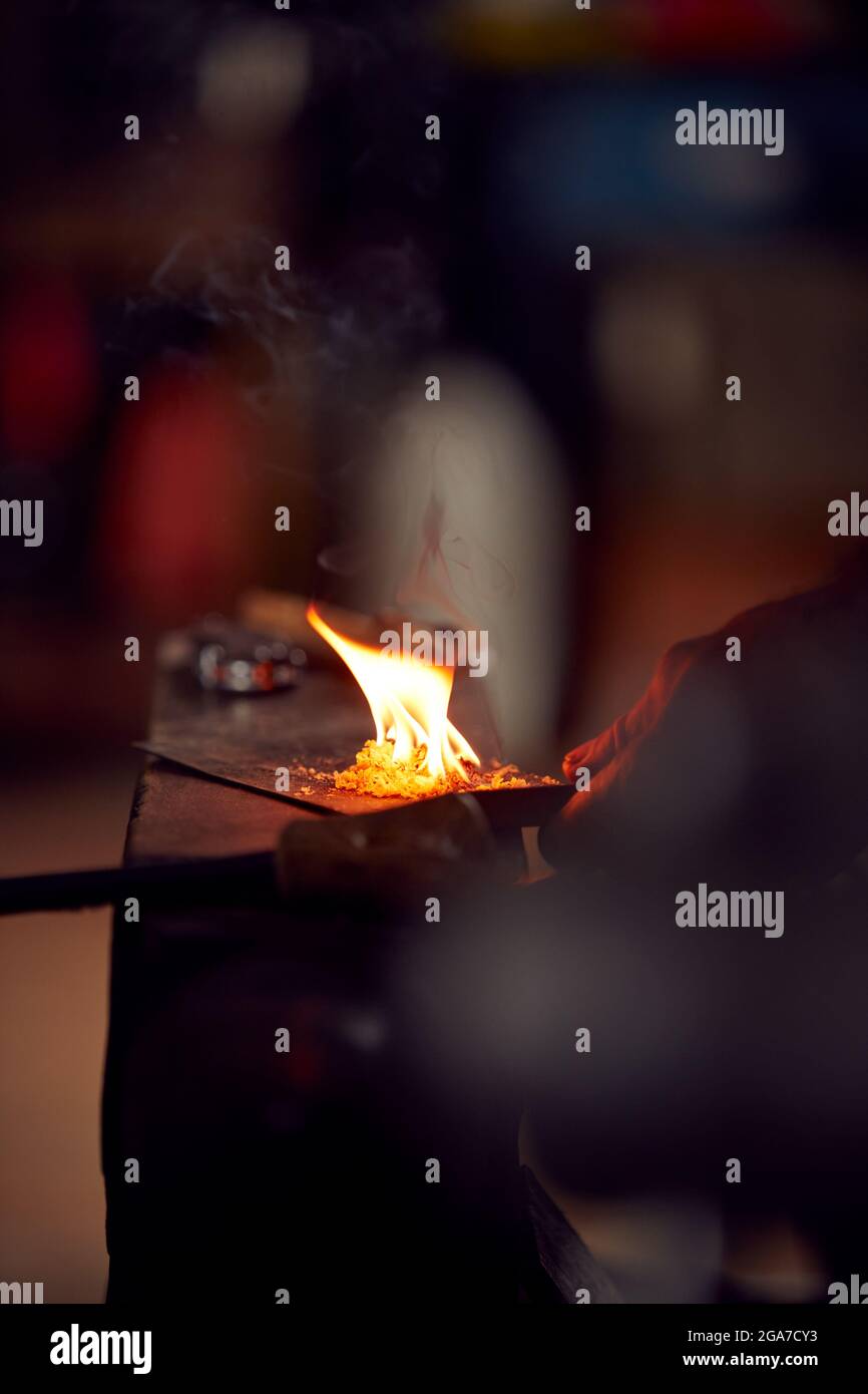 Close up male blacksmith lighting hi-res stock photography and images ...