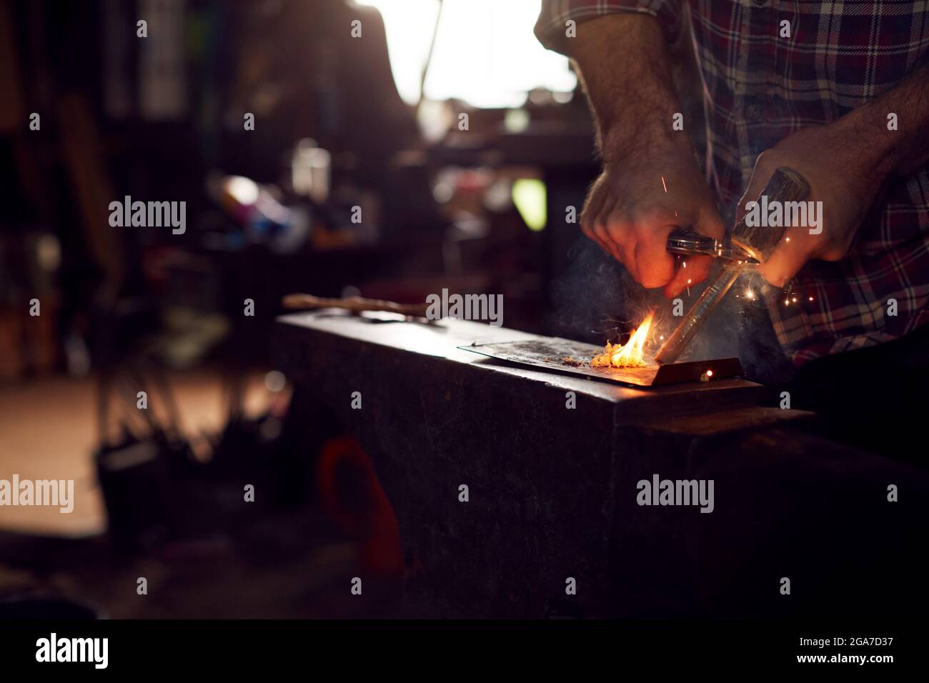 Close up male blacksmith lighting hi-res stock photography and images ...