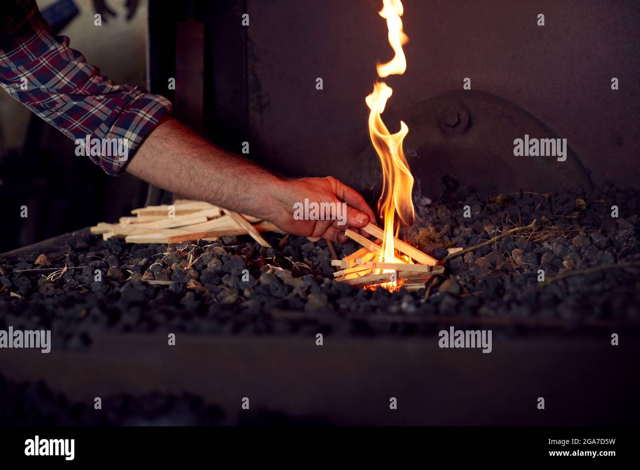 Close up male blacksmith lighting hi-res stock photography and images ...