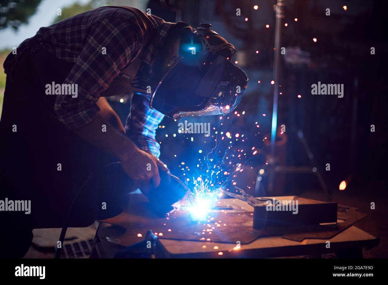 Male Blacksmith Wearing Protective Safety Visor Arc Welding Metalwork ...