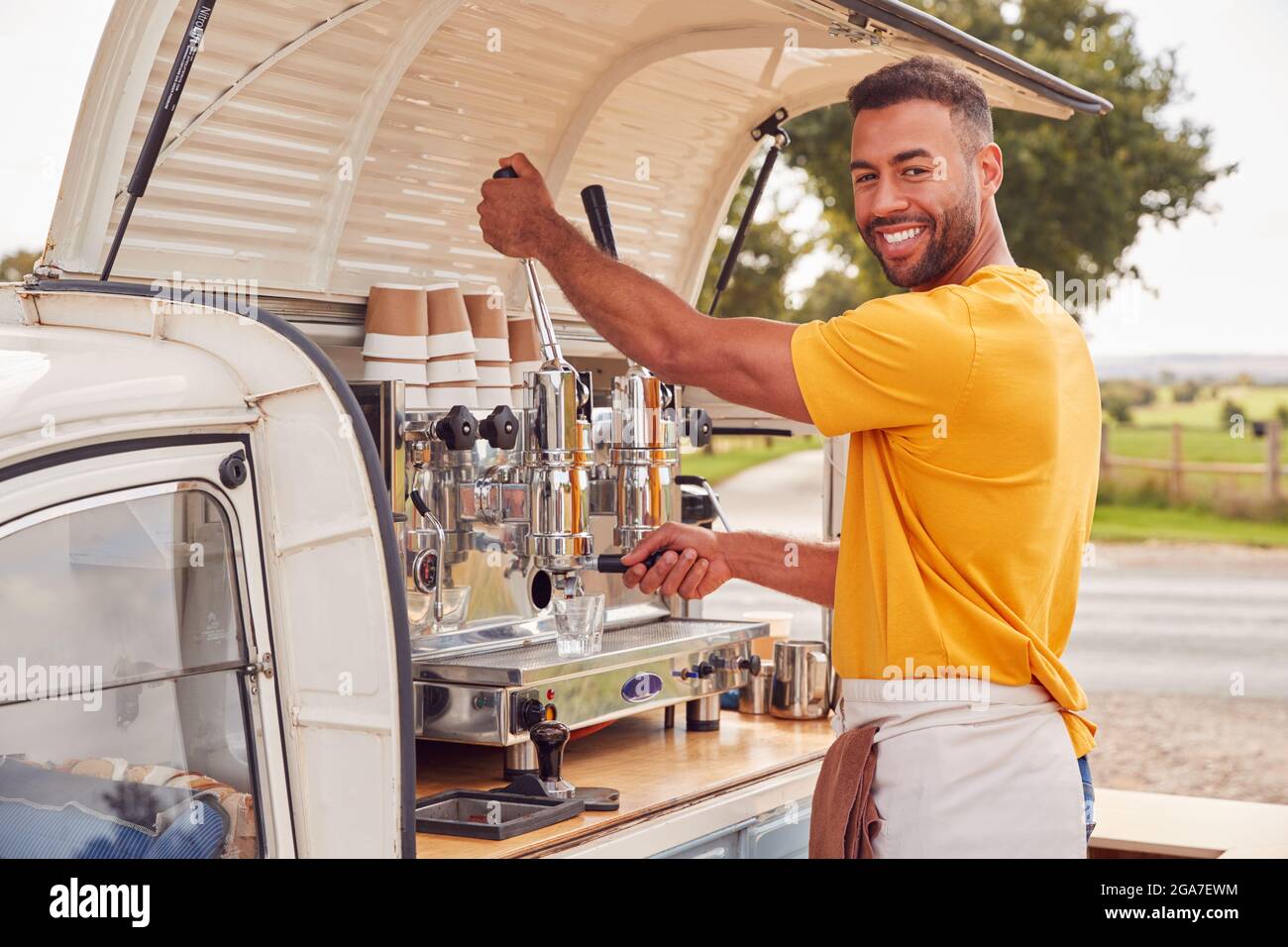 Portrait Of Man Running Independent Mobile Coffee Shop Preparing Drink ...