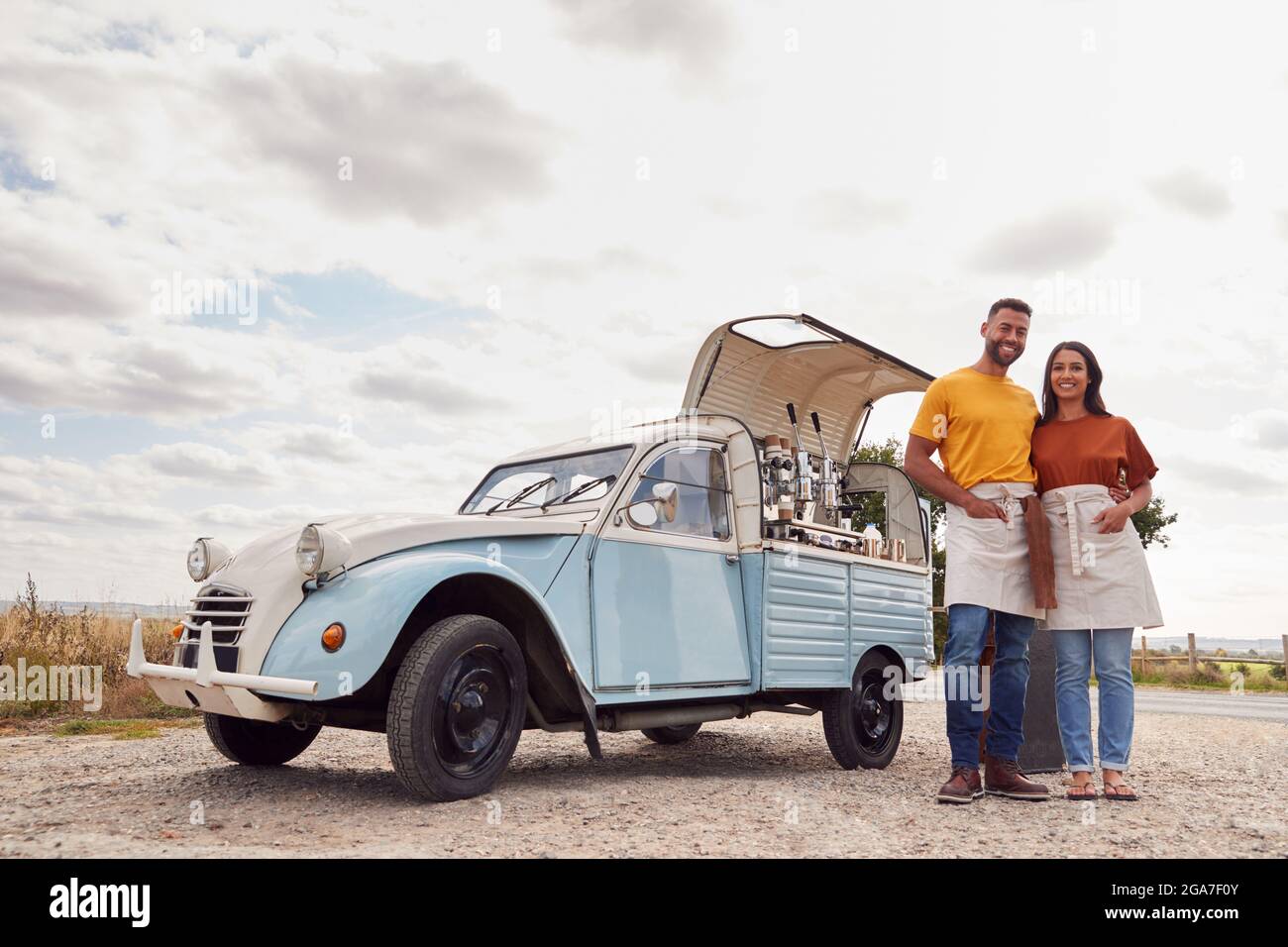 Portrait Of Couple Running Independent Mobile Coffee Shop Standing ...