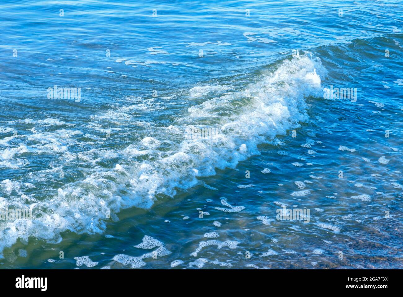 Areal shot of deep blue and rough sea with lot of sea spray.Blue ...